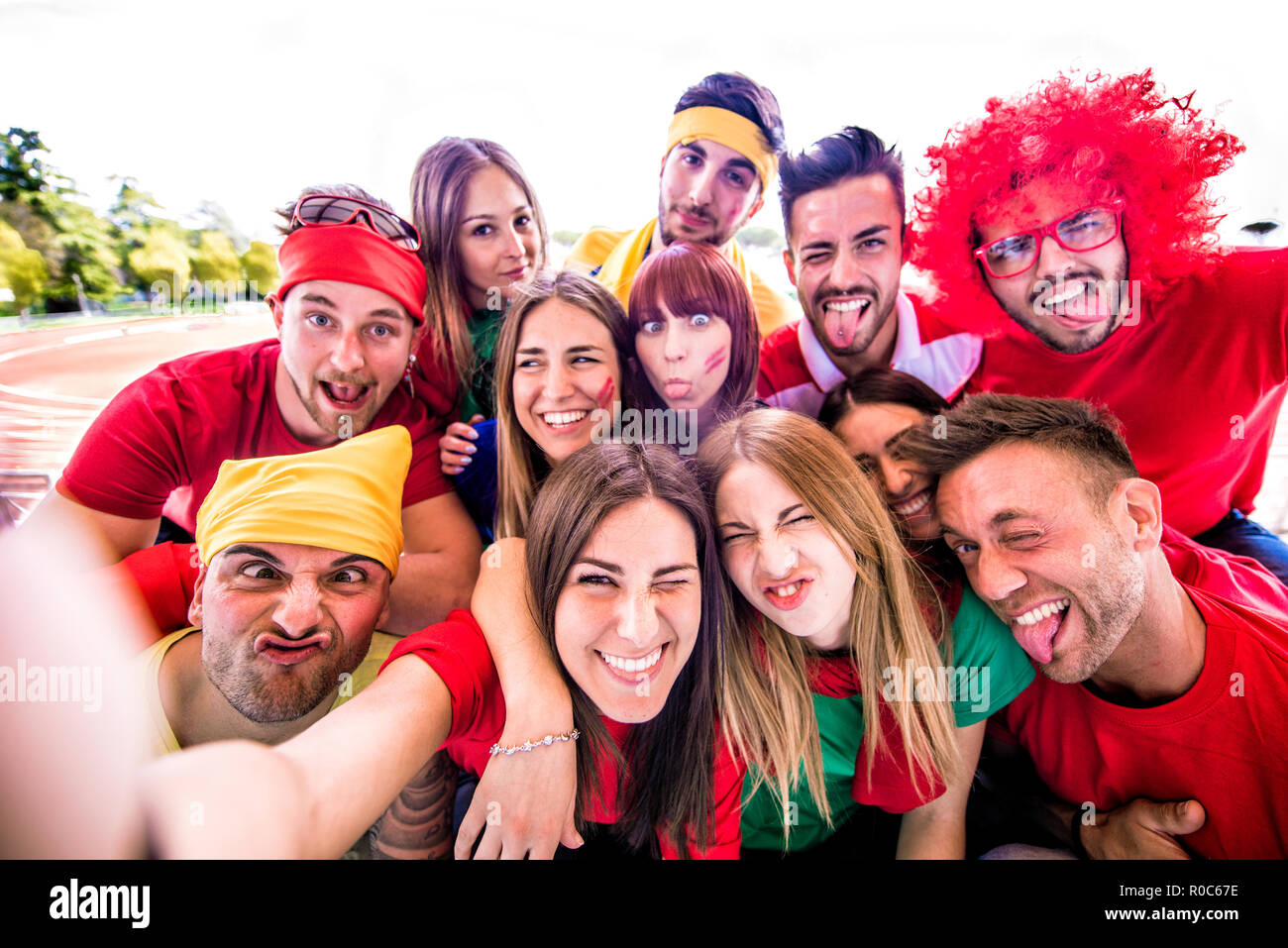 Group of football fans taking a selfie at thestadium Stock Photo - Alamy