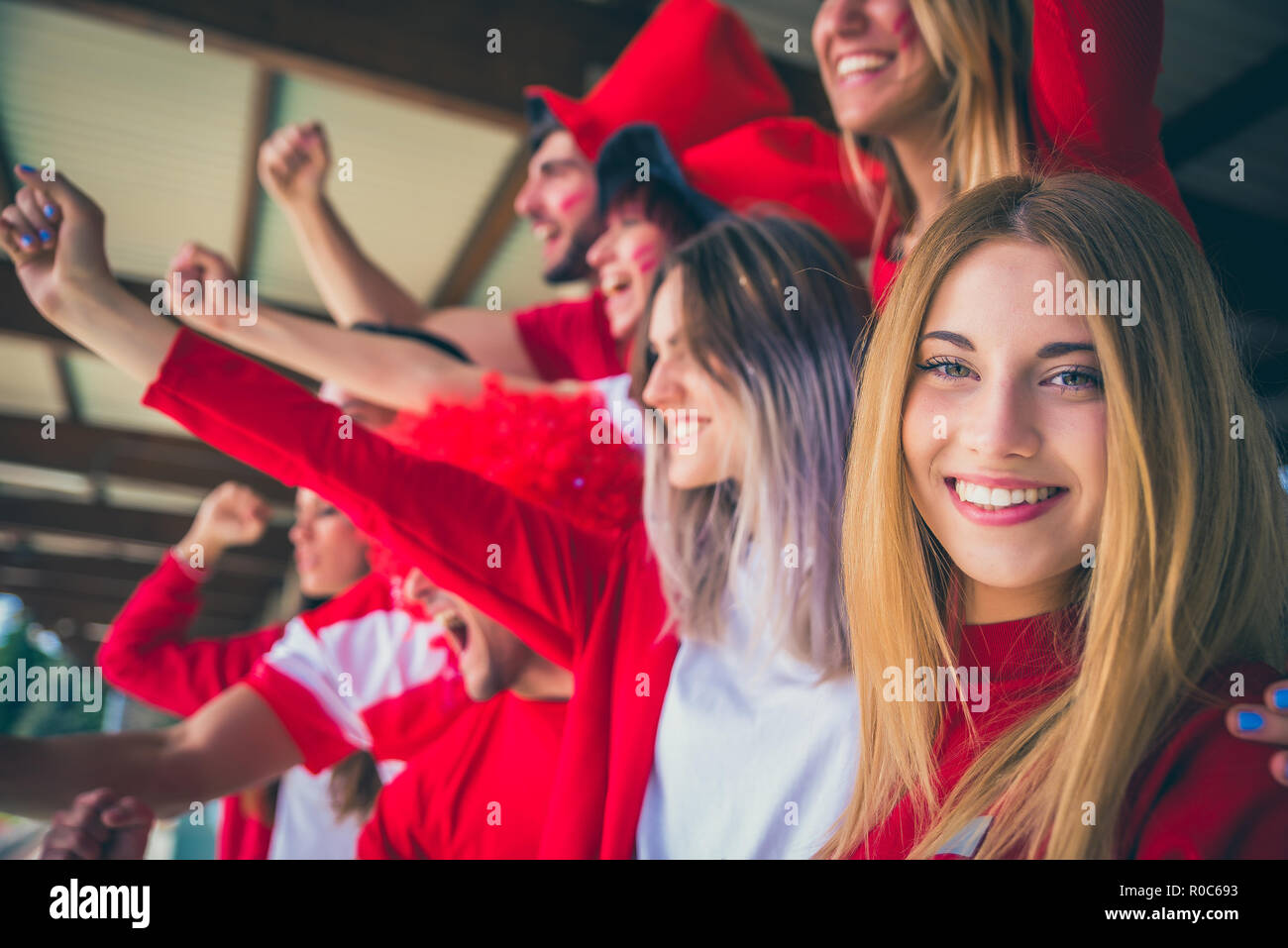 Football supporters at the stadium - Football fans having fun and ...