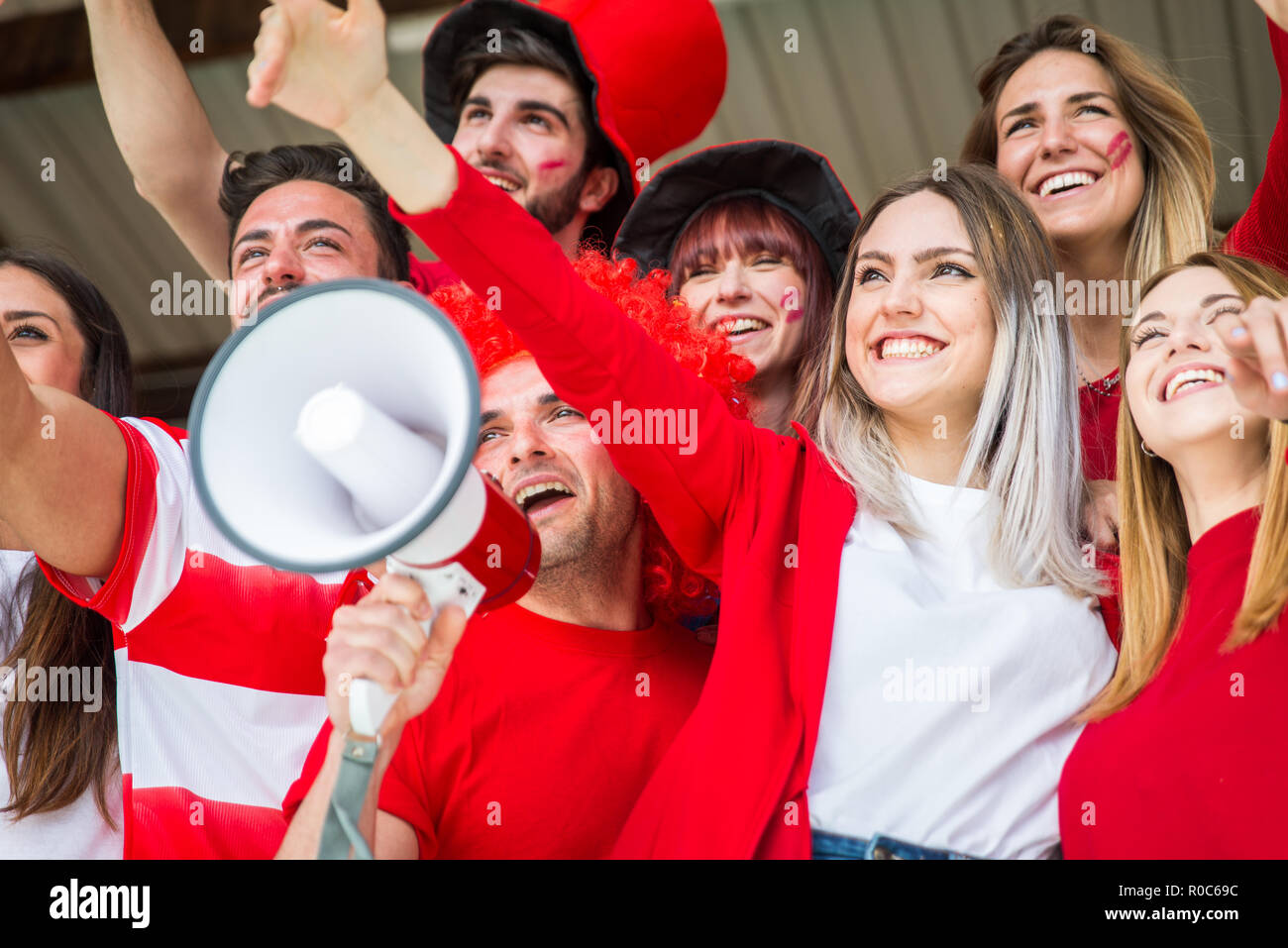 Football supporters at the stadium - Football fans having fun and ...