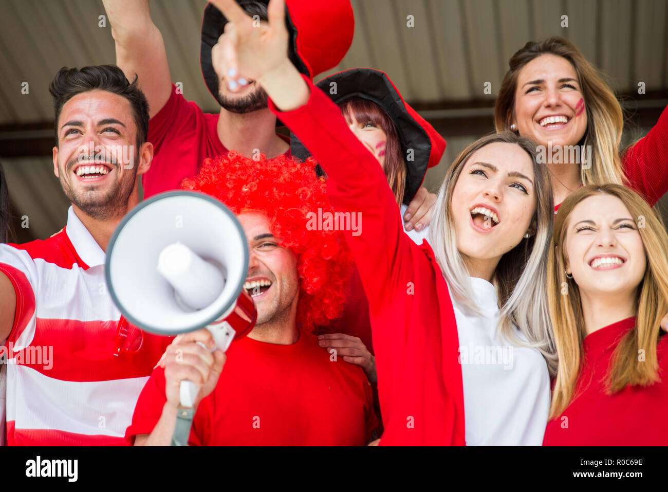 Football supporters at the stadium - Football fans having fun and ...
