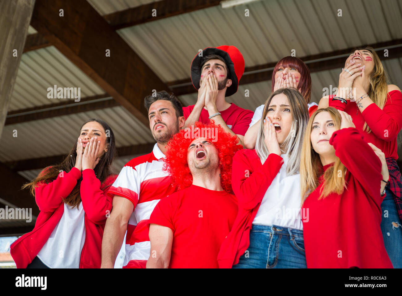 Football supporters at the stadium - Football fans having fun and ...