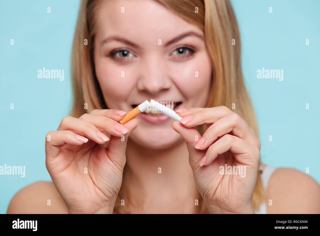 Smilling pretty girl breake down cigarette. Winning with addicted ...