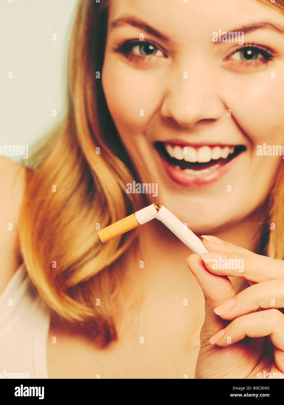 Smilling pretty girl breake down cigarette. Winning with addicted ...