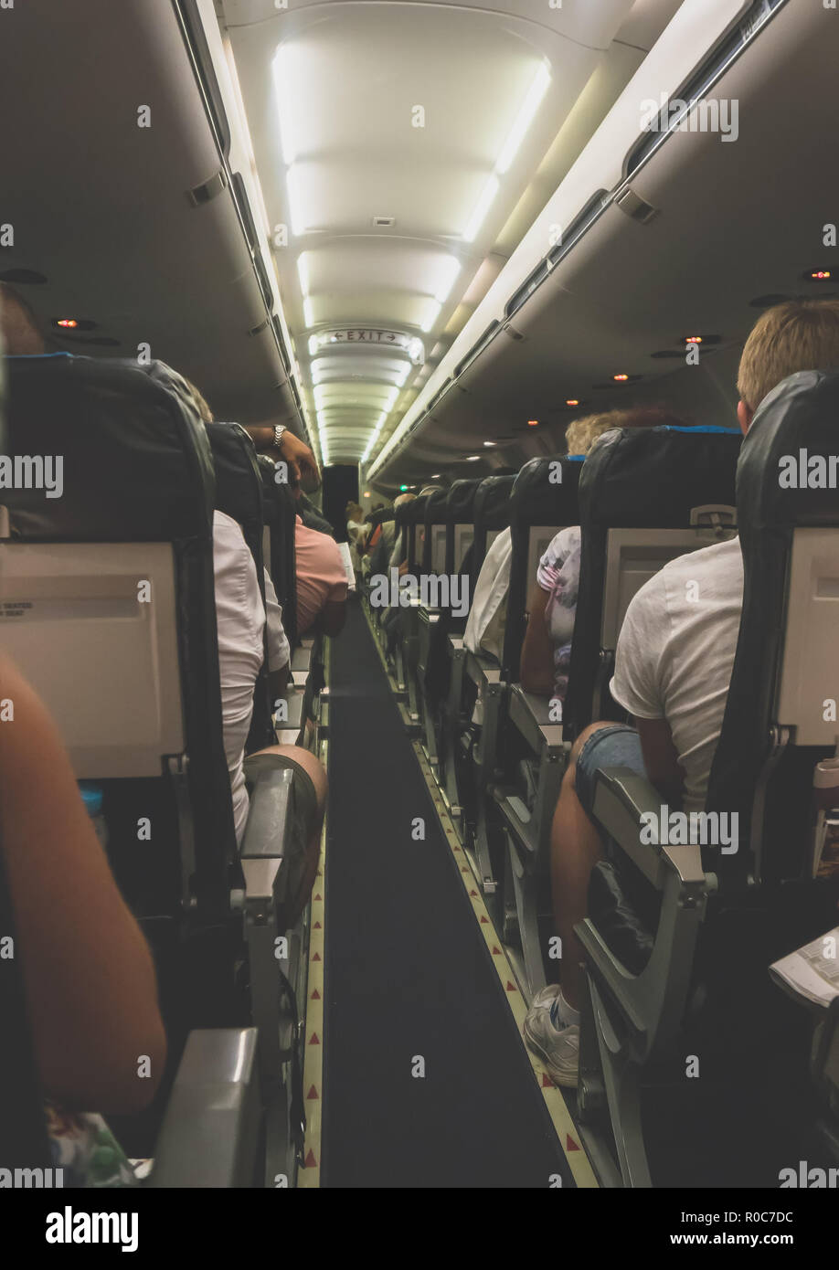 Interior inside of the plane with passengers Stock Photo - Alamy