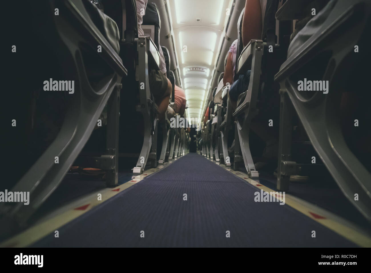 Interior inside of the plane with passengers Stock Photo - Alamy