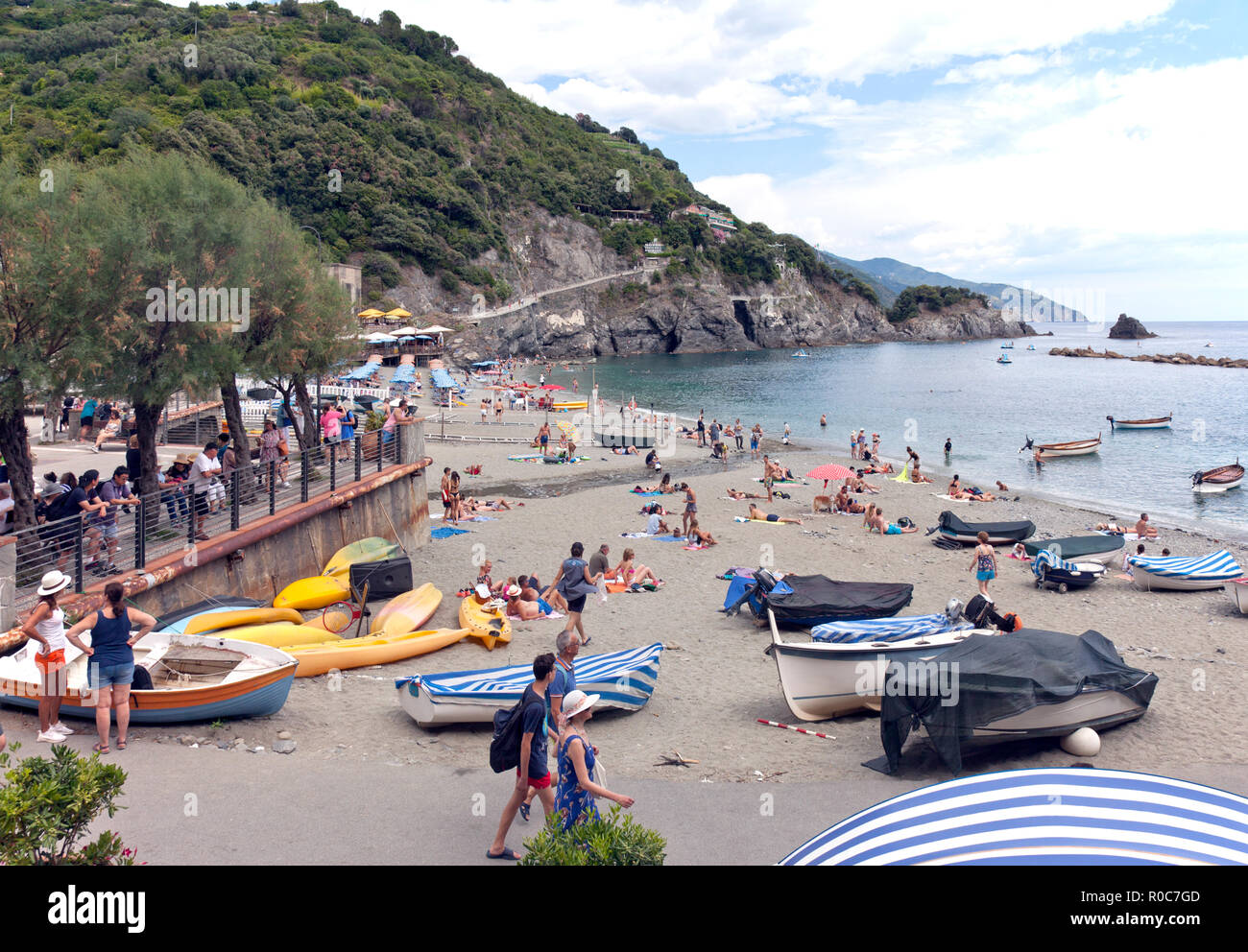 The beach at the foot of Old Town Monterosso al Mare. Old town is ...