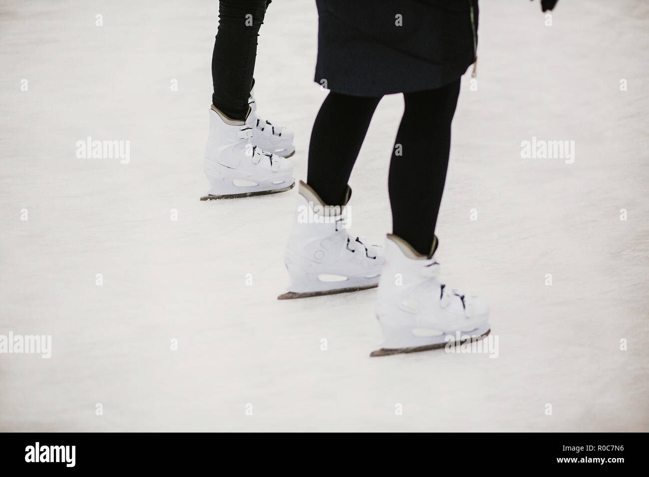 Skaters skating on iceskating ring in european city center in winter ...