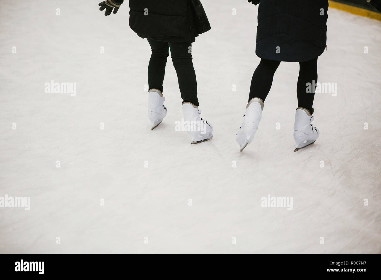 Skaters skating on iceskating ring in european city center in winter ...