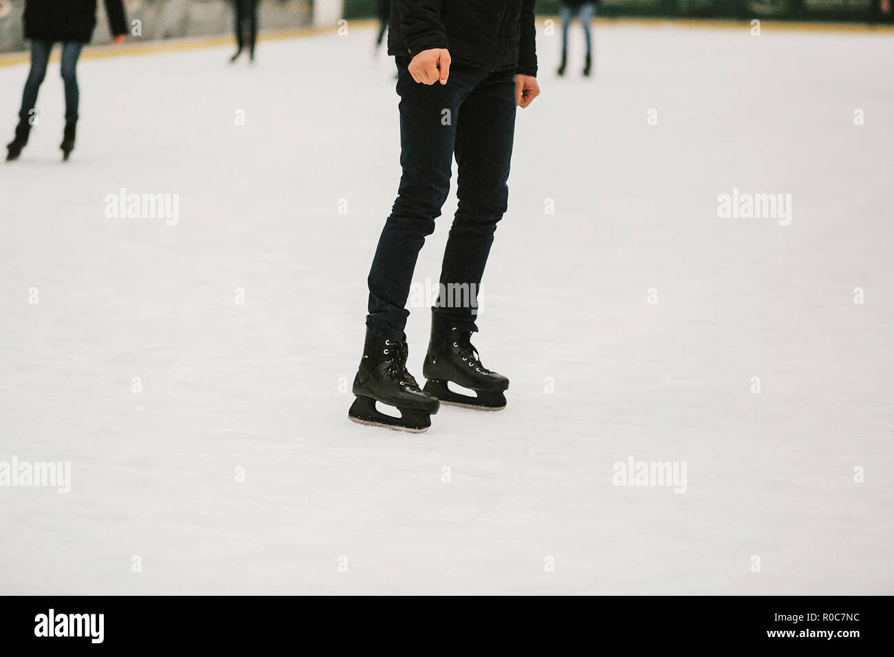Skaters skating on iceskating ring in european city center in winter ...
