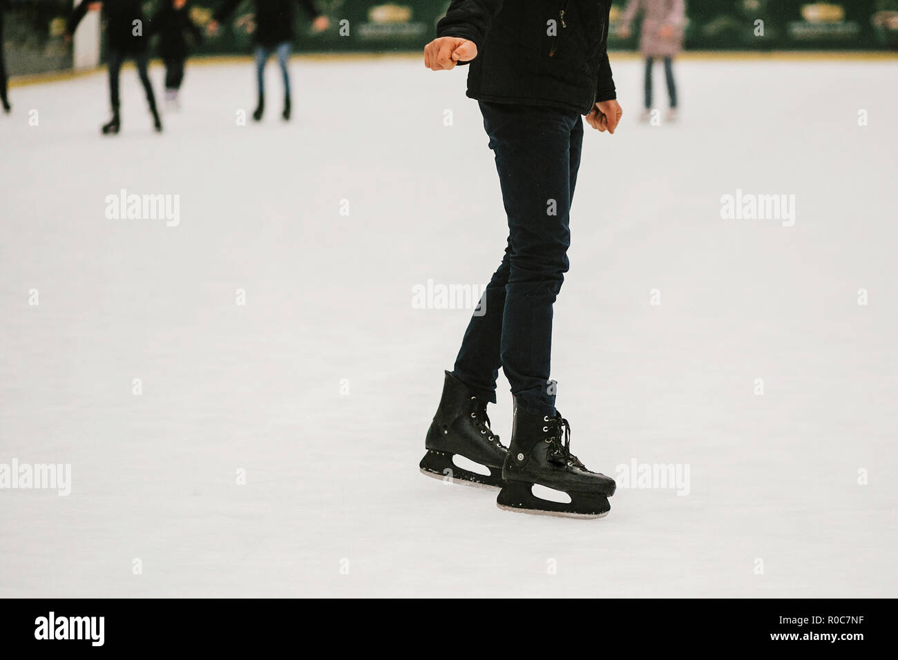 Skaters skating on iceskating ring in european city center in winter ...