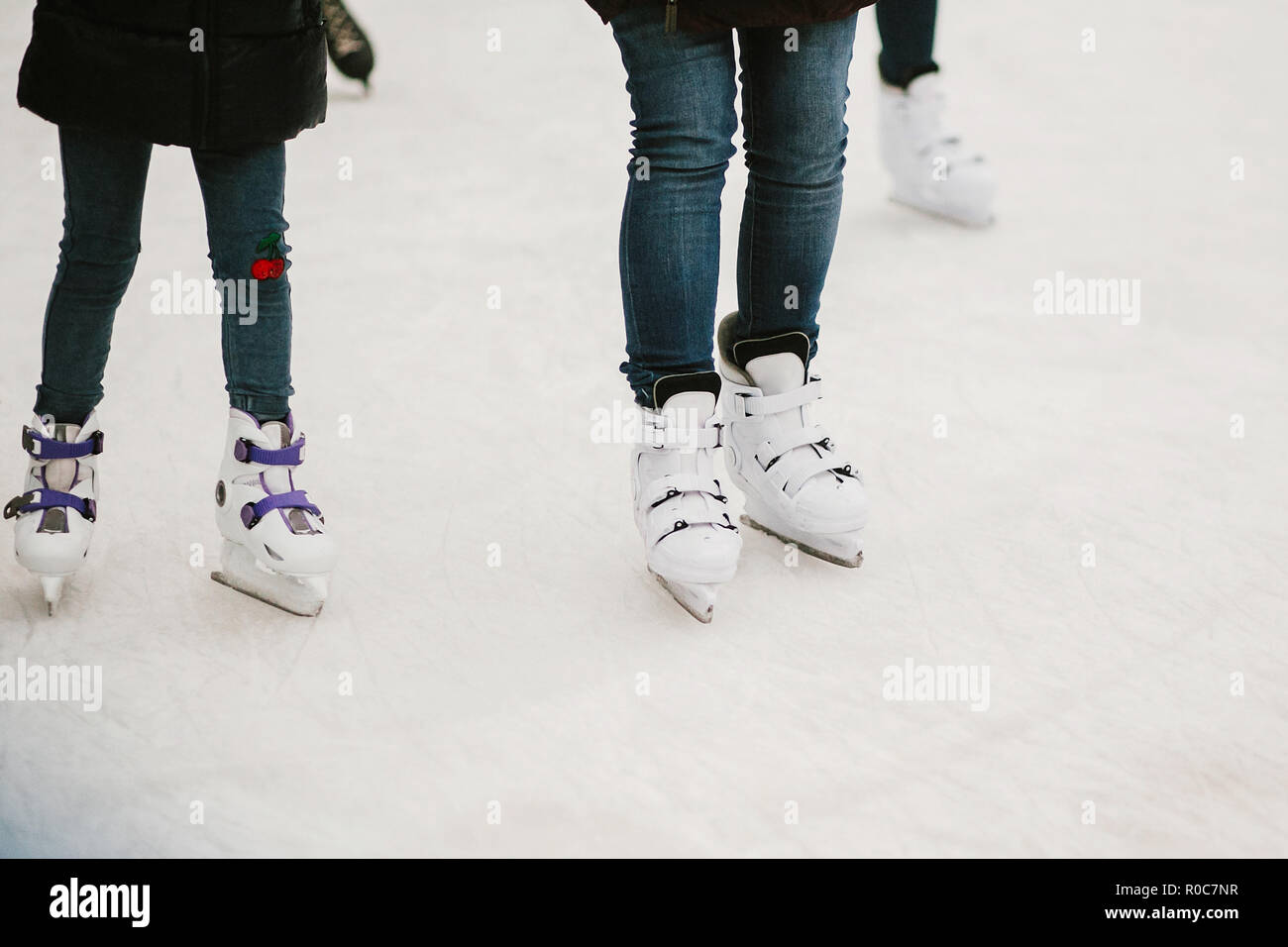 Skaters skating on iceskating ring in european city center in winter ...