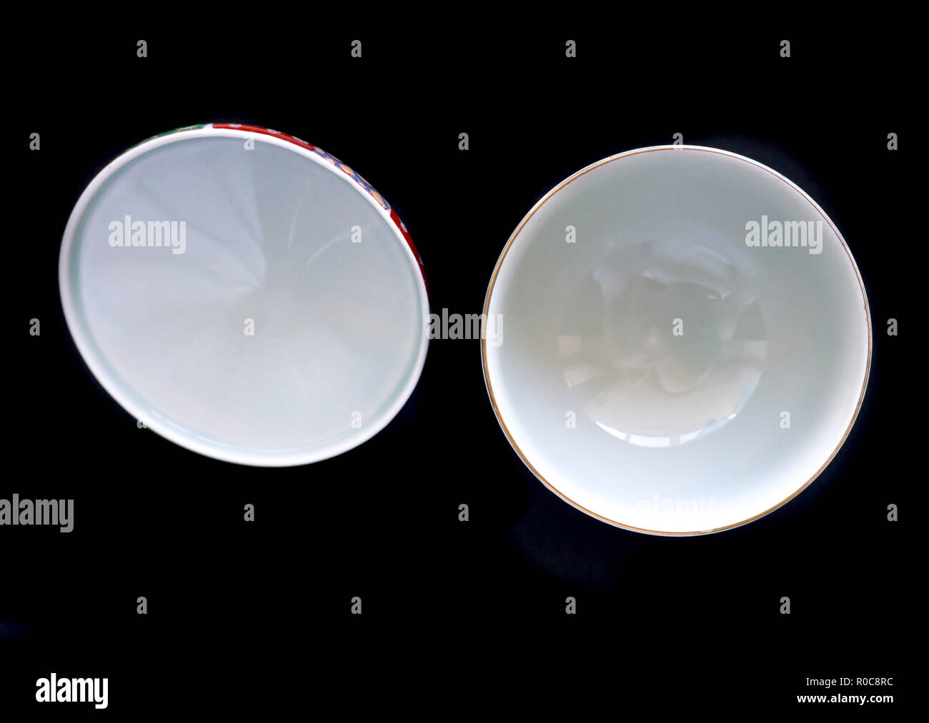 Old vintage Porcelain in a black background Stock Photo - Alamy