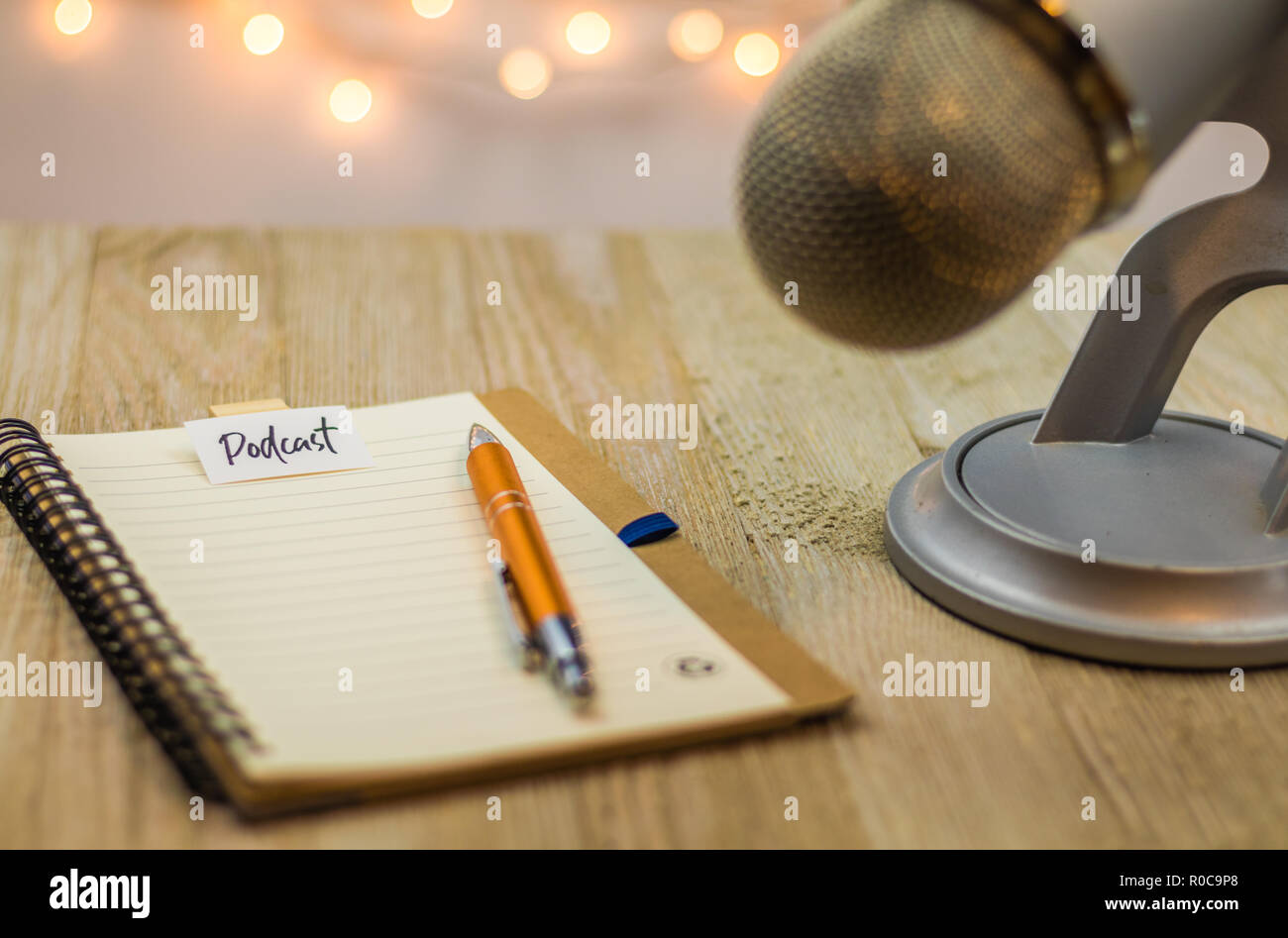 Podcast ideas concept with microphone, notepad, tablet on board Stock ...