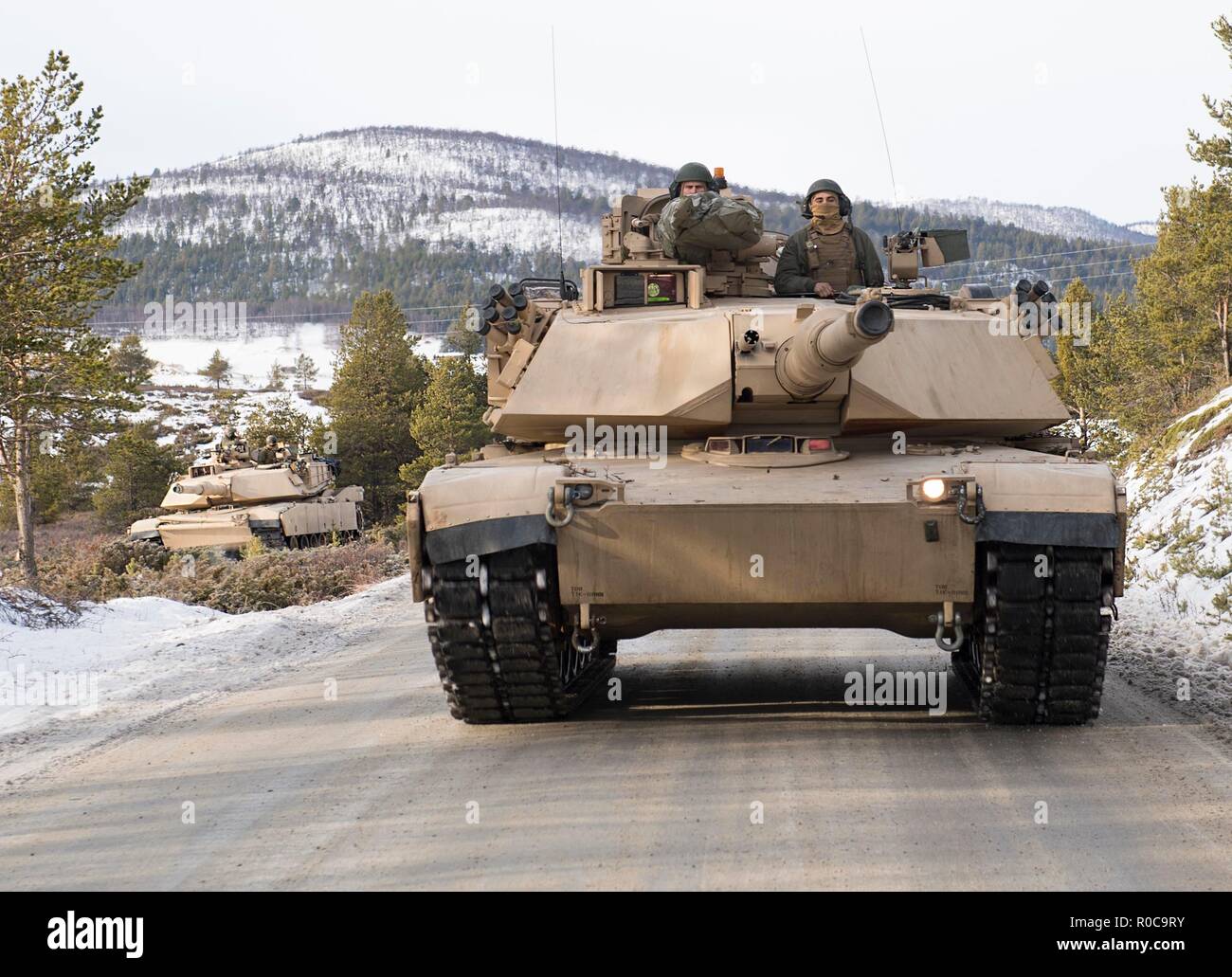 U.S. Marines with 2nd Tank Battalion, 2D Marine Division, advance on ...