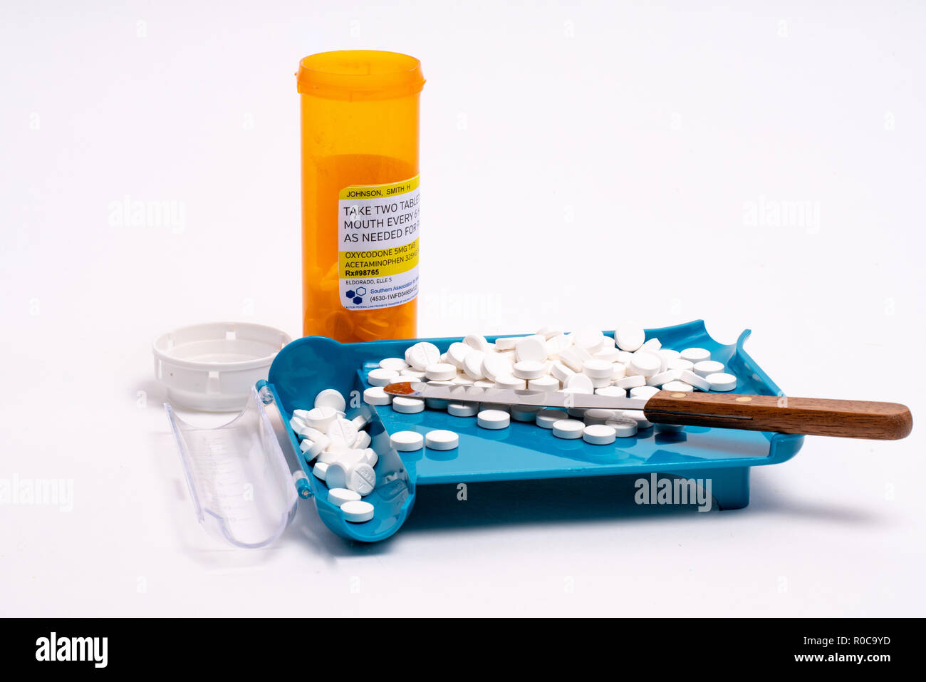 Prescription medication is laid out on a pharmacists counting tray ...