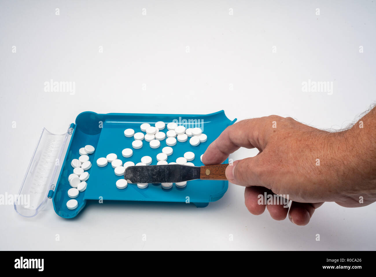 Prescription medication is laid out on a pharmacists counting tray ...