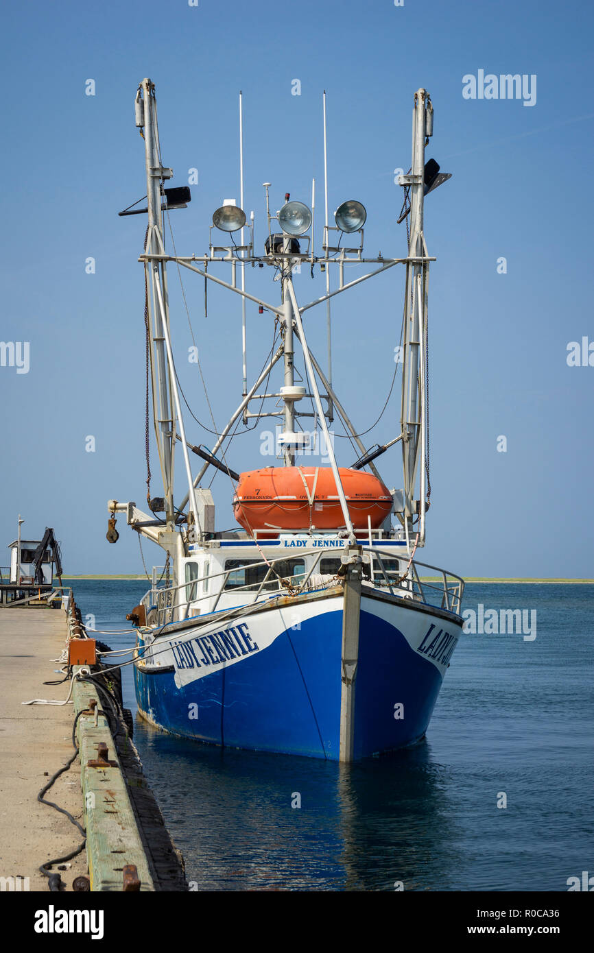 Fishing boat alongside a wharf in the Magdalen Islands, Quebec, Canada ...