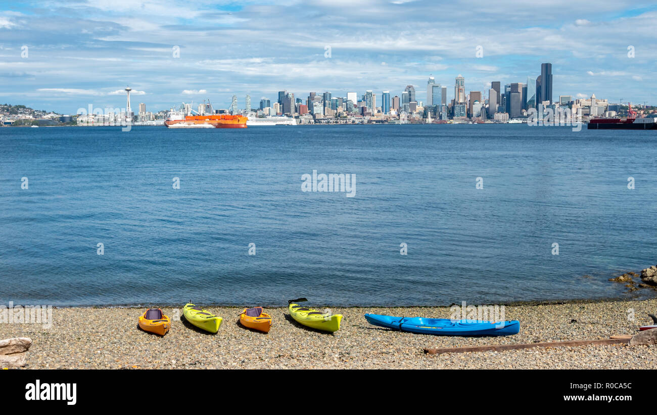Multiple Kayak on Rock Beach with Downtown Seattle Skyline in the ...