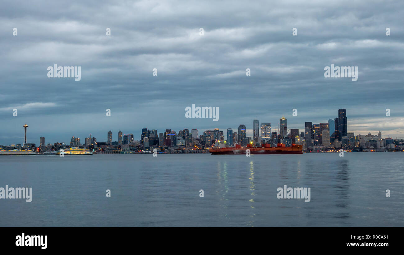 Downtown Seattle Light Up at night with Cloudy Skies Stock Photo - Alamy