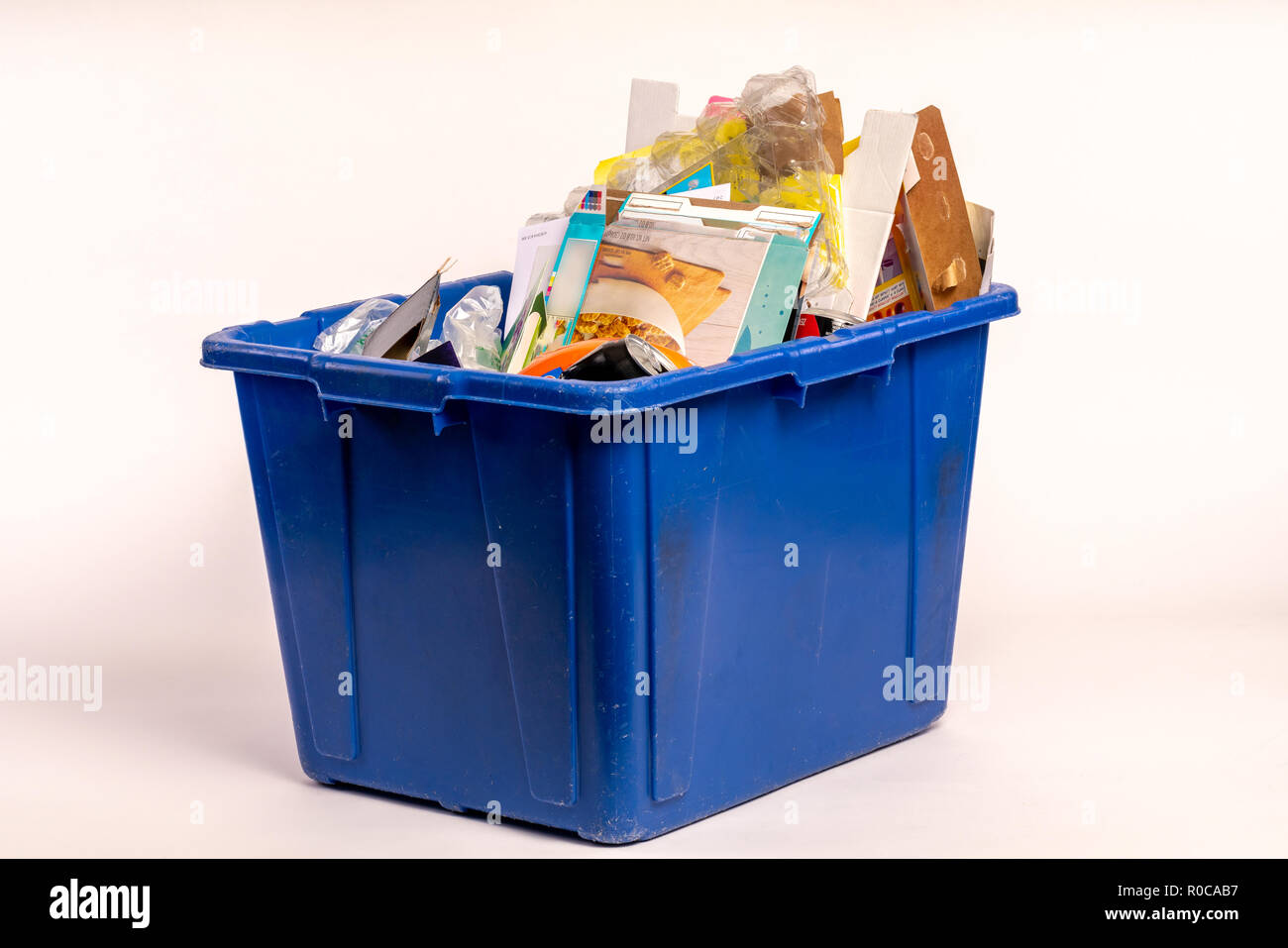Blue plastic recycle bin for glass, plastic and glass Stock Photo - Alamy
