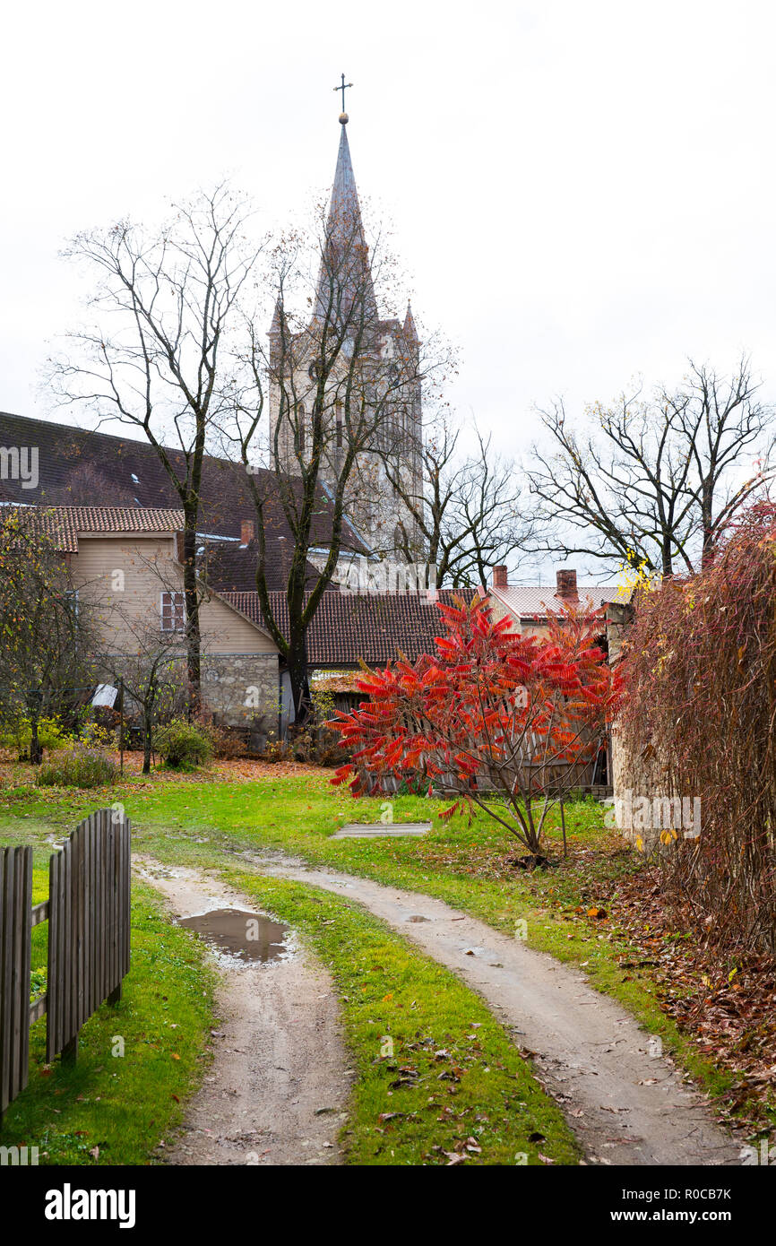 City Cesis, Latvia. Old church and city streets at autumn. Leafs ...