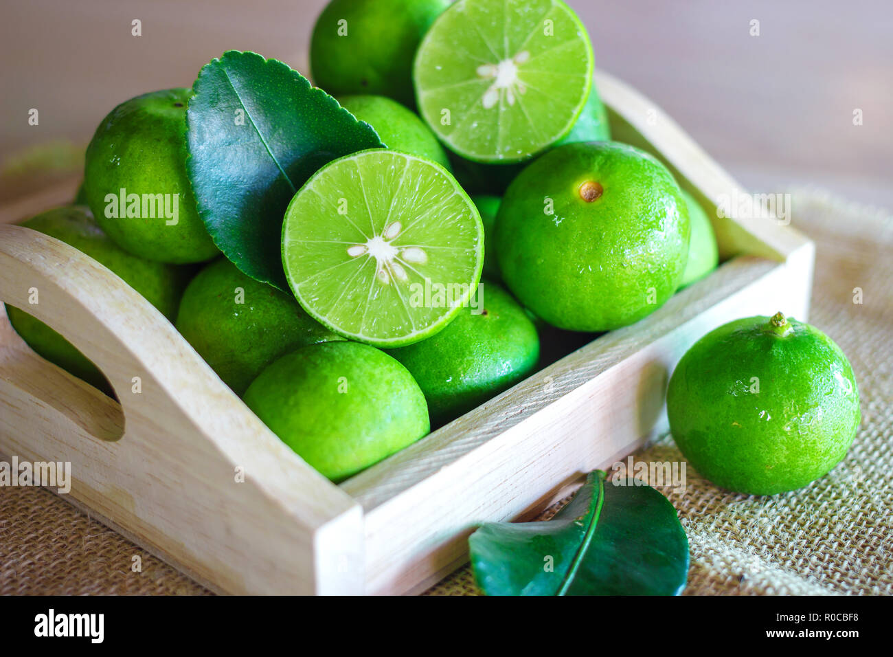 Fresh Citrus lime fruit in wooden box Stock Photo - Alamy