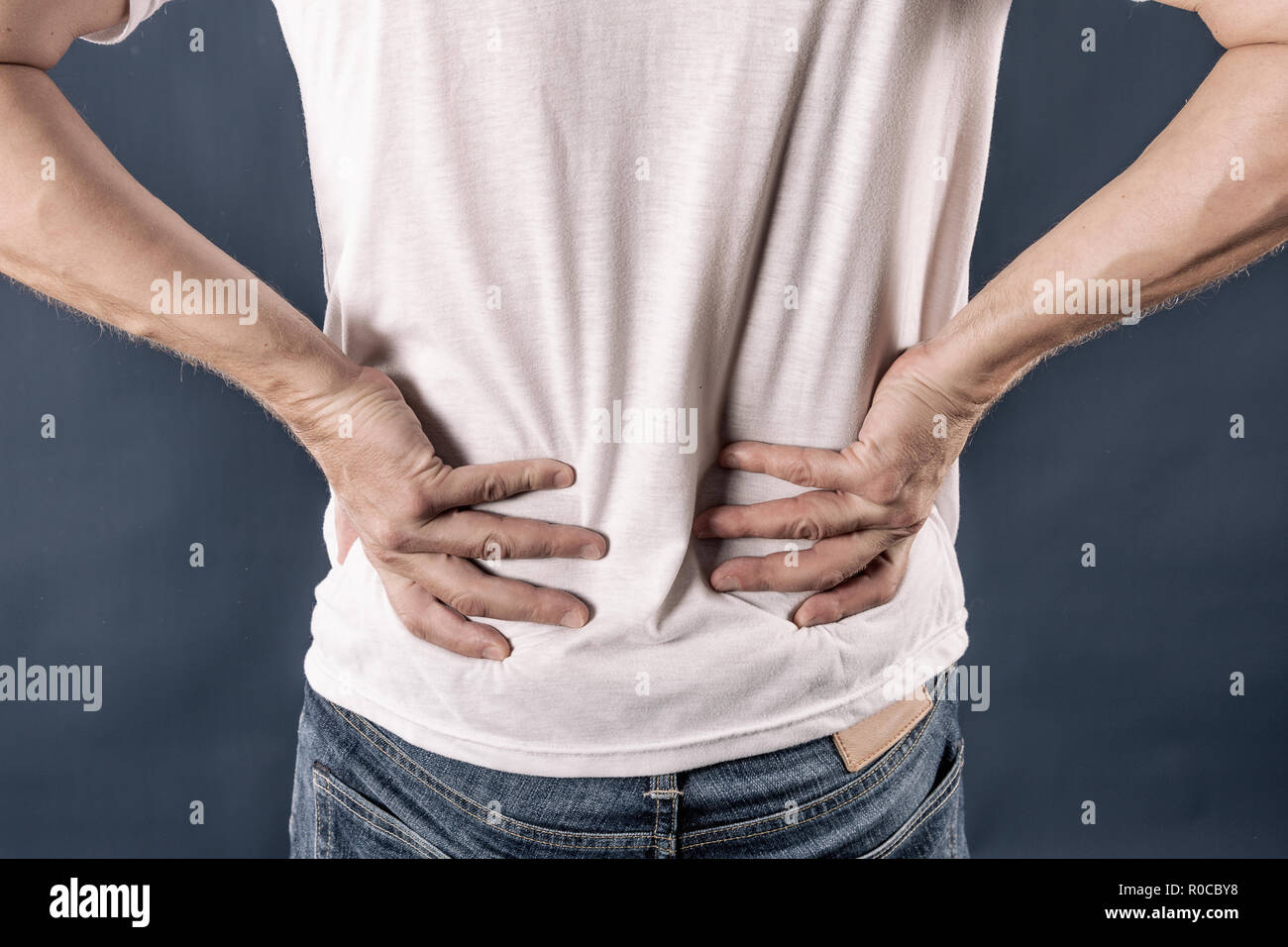 Man holding his painful inflamed loin. Health care and medicine Stock ...