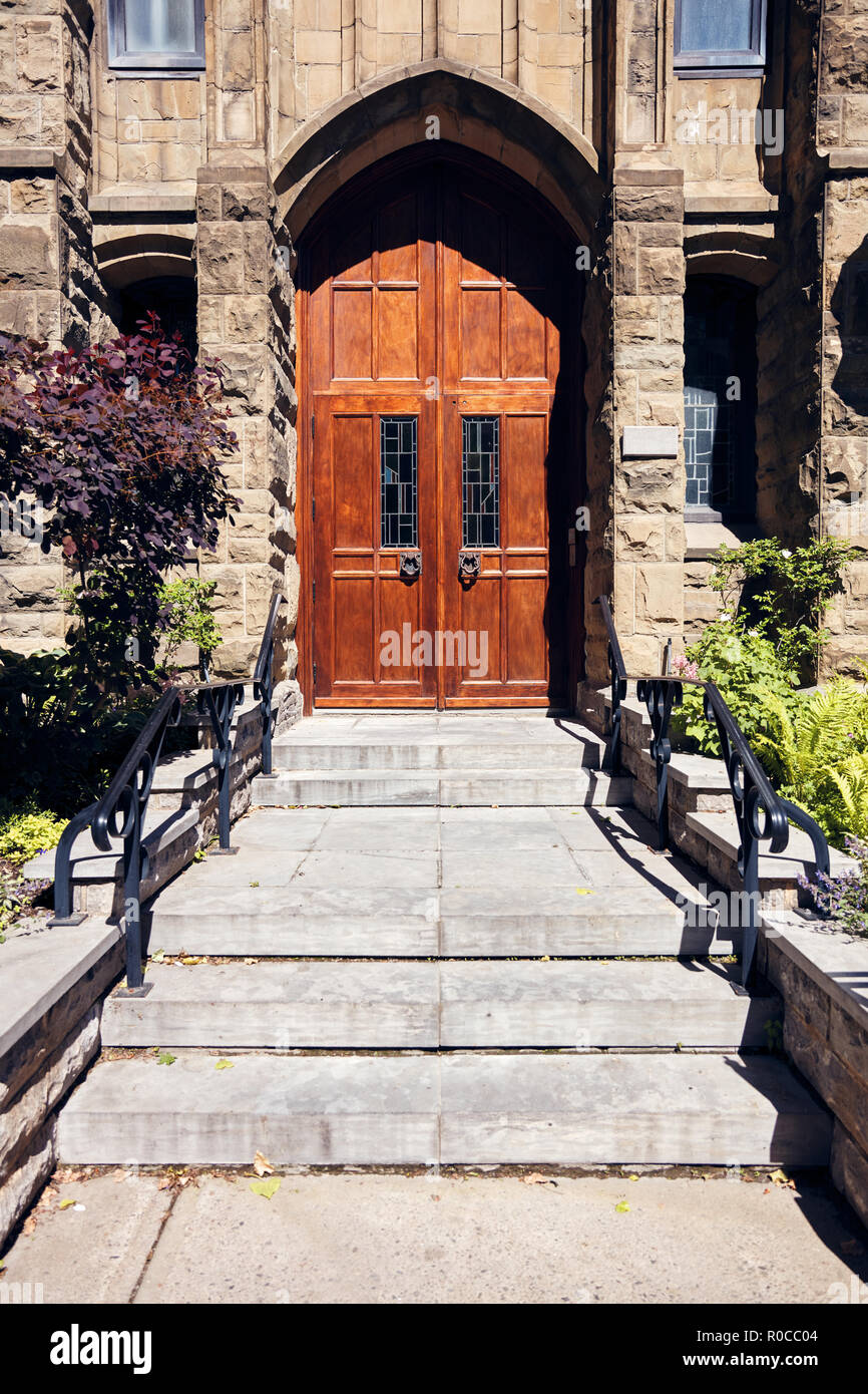 Maple antique wooden entrance door of an historical house in Montreal ...