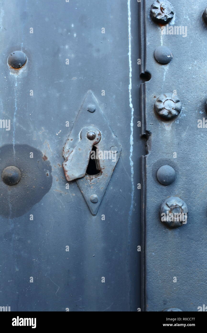 The Old steel door, keyhole closes Stock Photo - Alamy