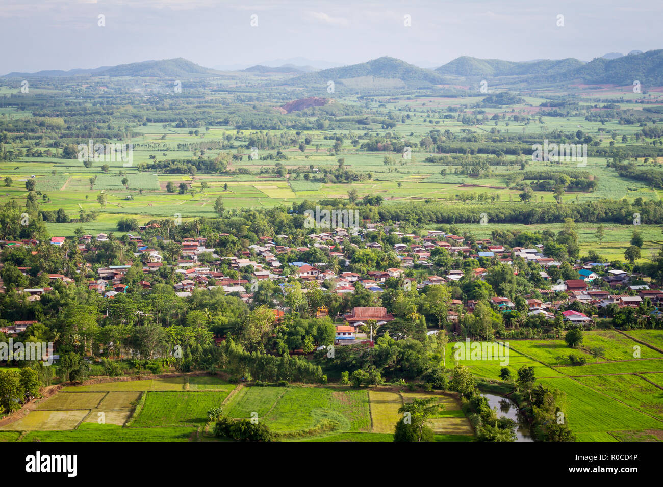 Landscape photo of rice and village in thailand Stock Photo - Alamy