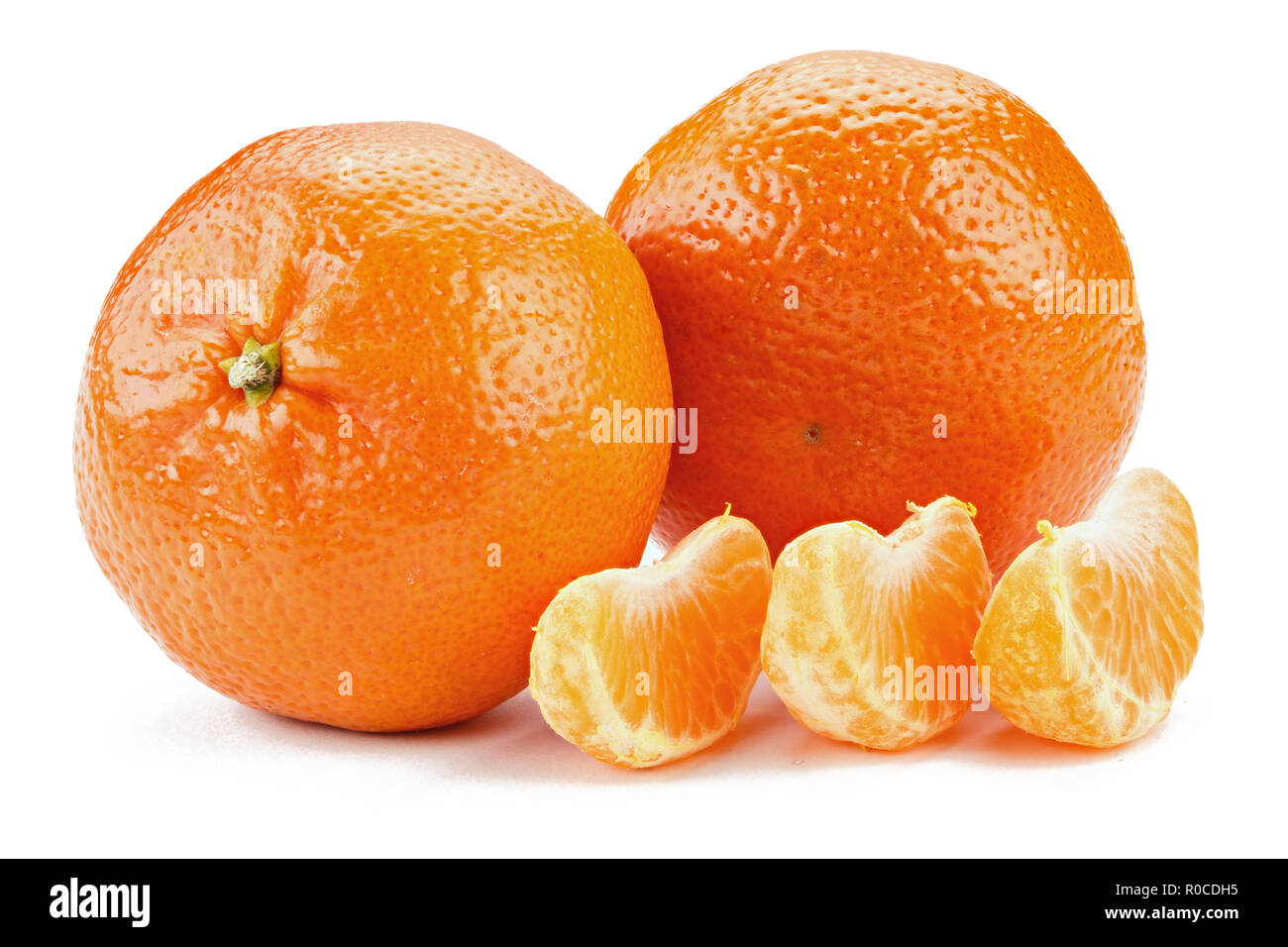 two whole ripe tangerines and slices of tangerine. isolated on white ...