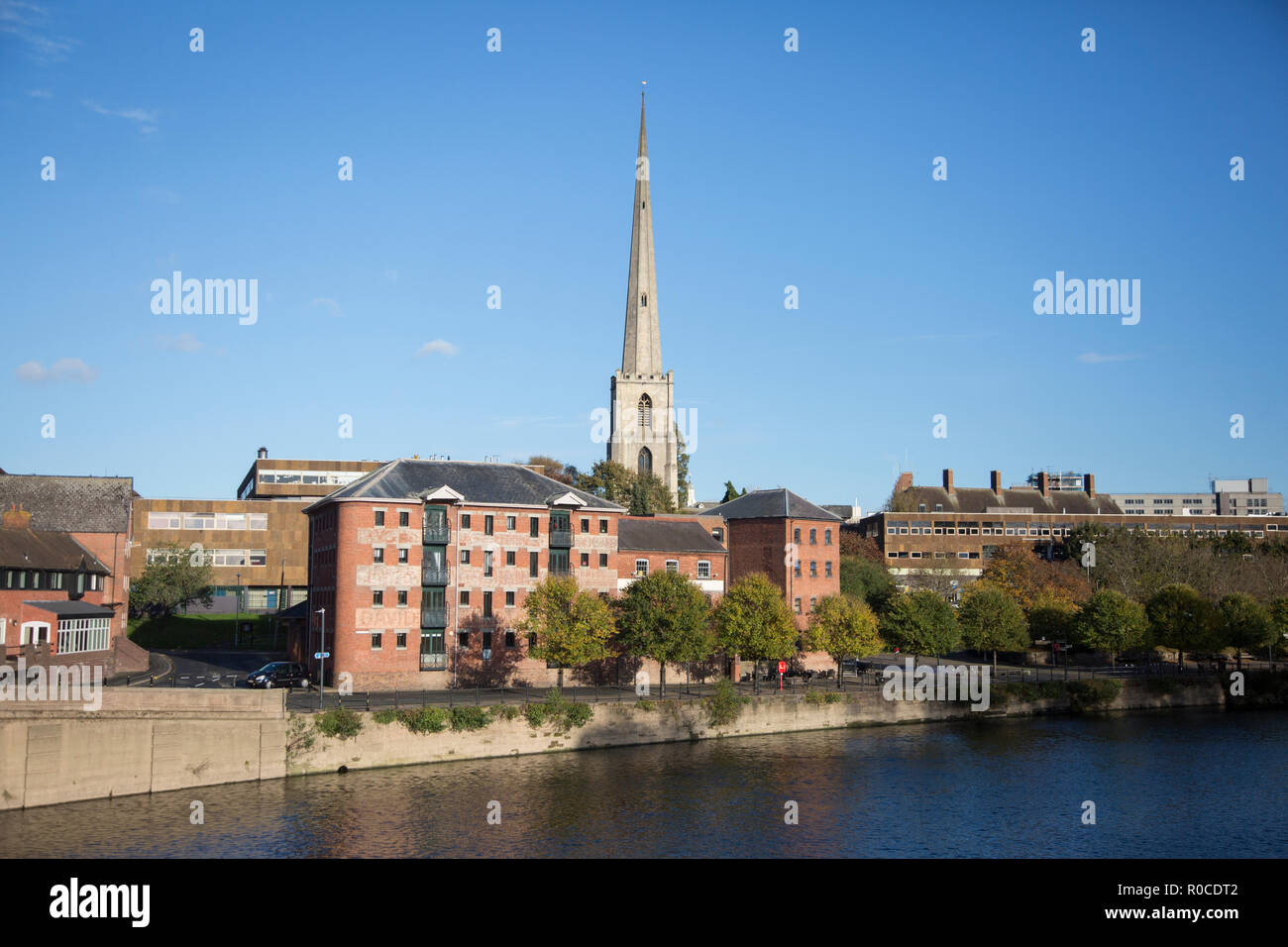 River passing next to Worcester cathedral on a sunny day with a blue ...