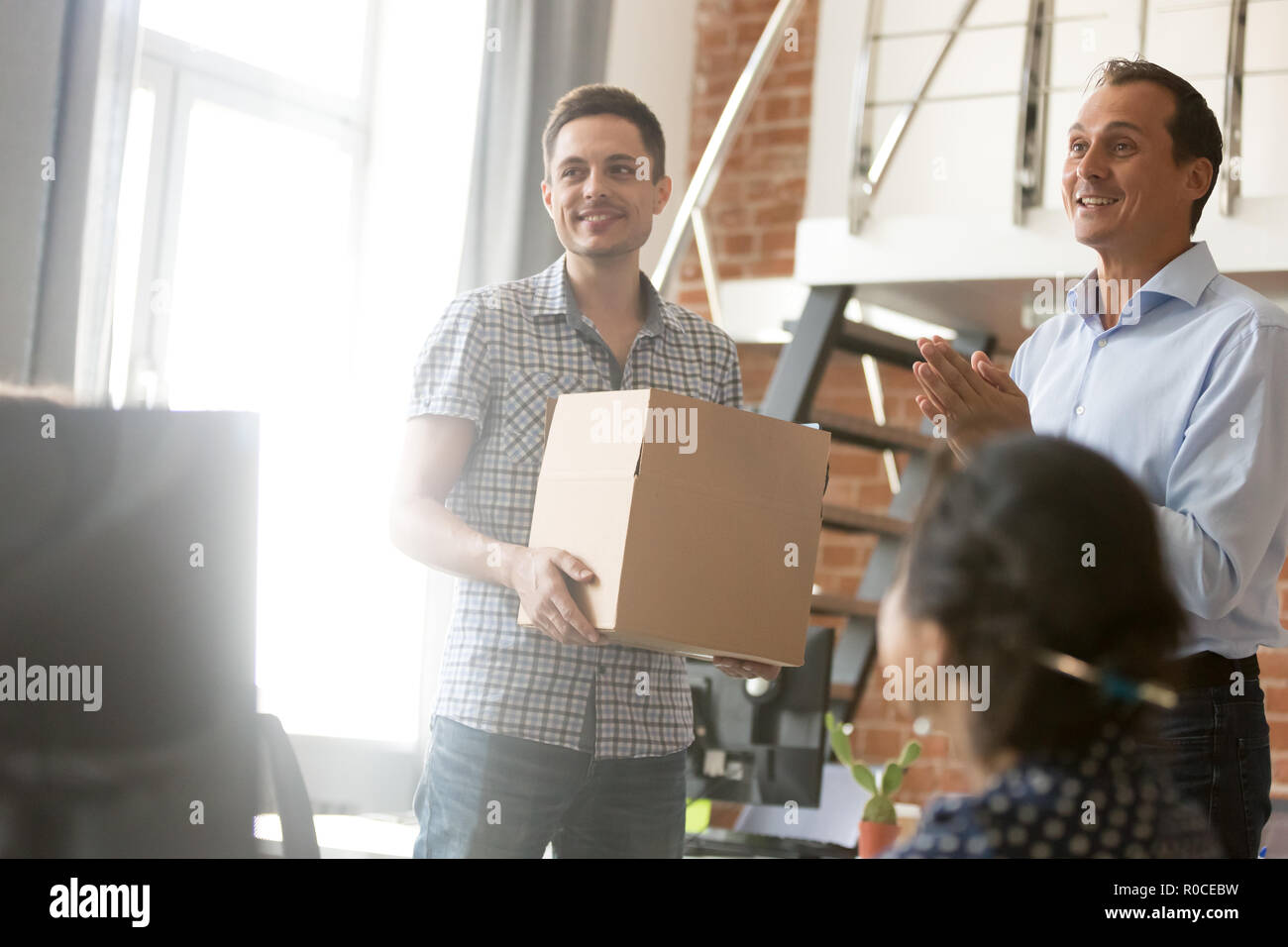 Company boss introducing new employee hi-res stock photography and ...