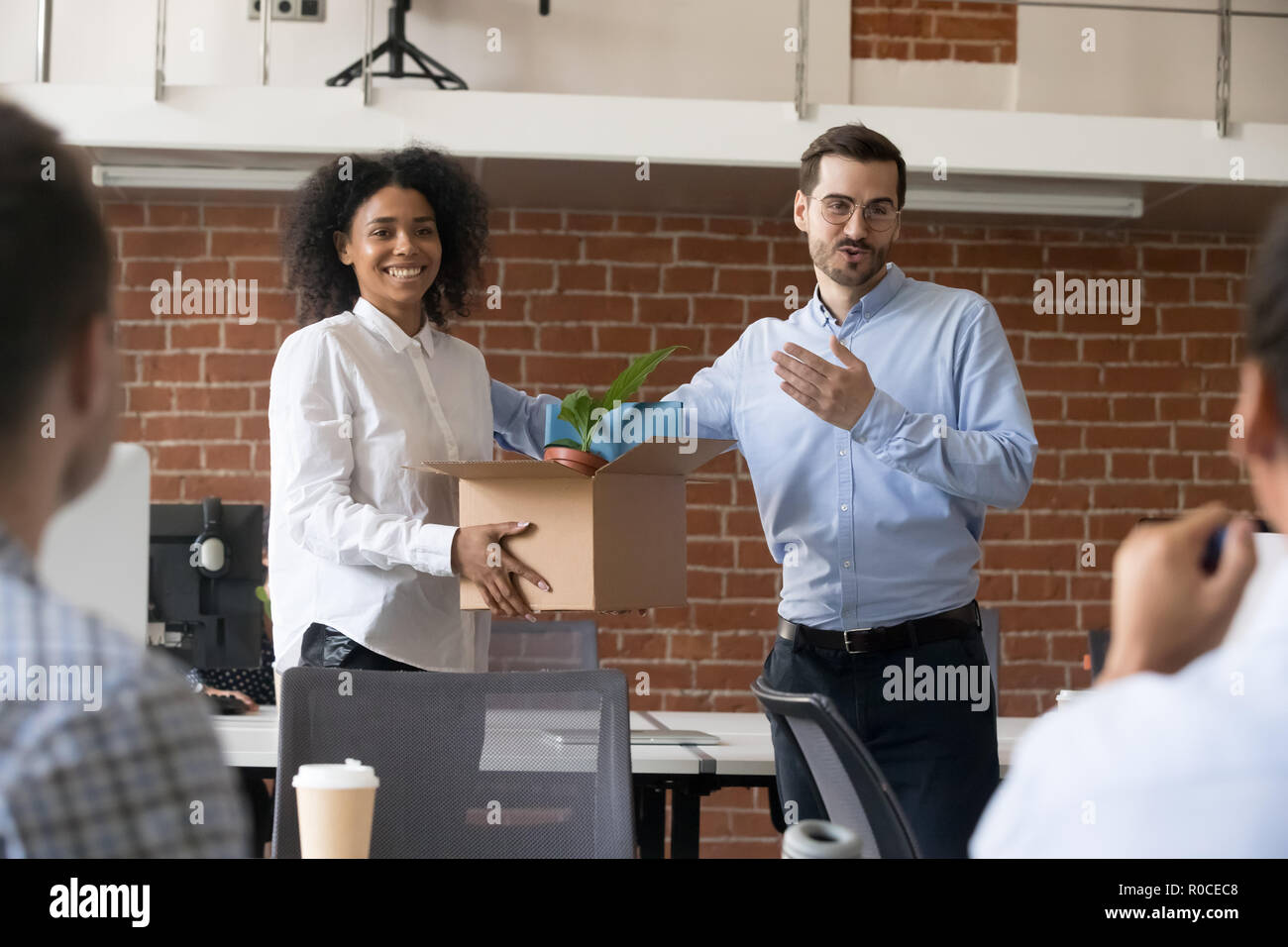 Friendly company ceo welcoming african employee in multiracial o Stock ...