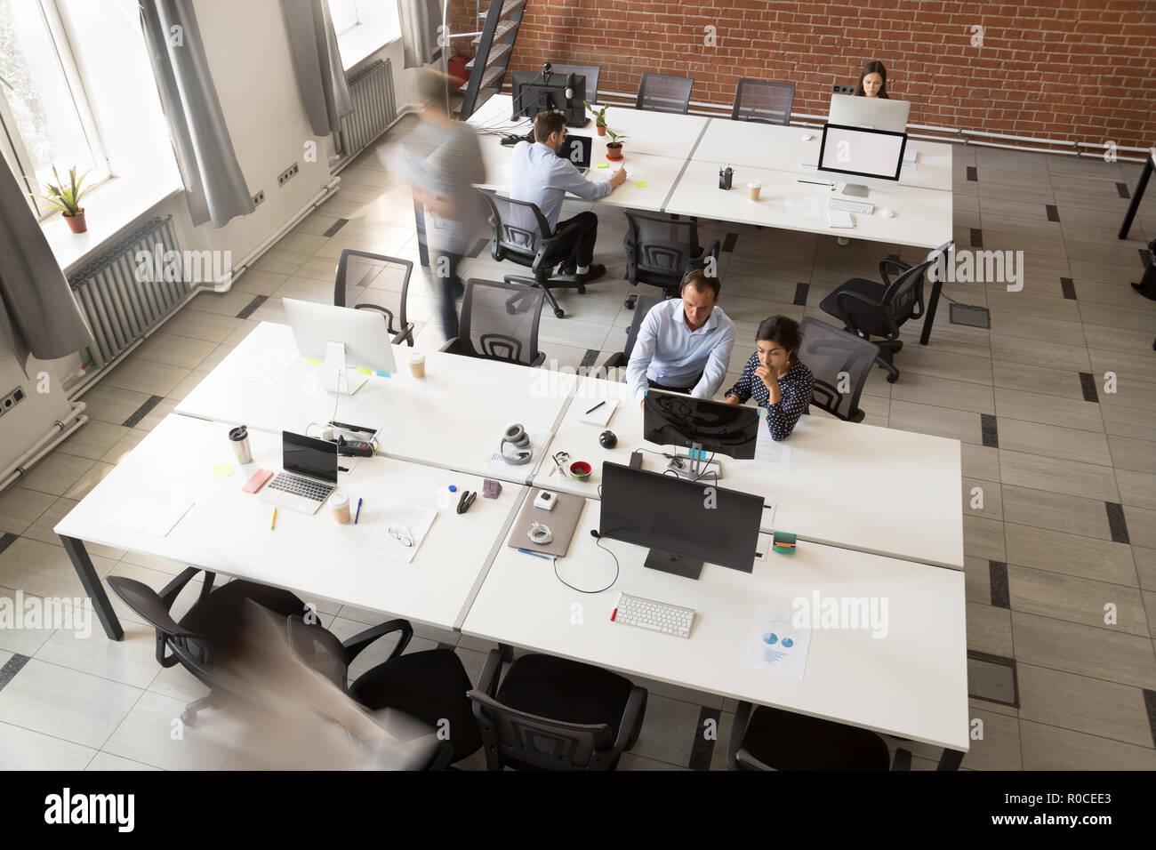 Modern coworking with team people working on computers, top view Stock ...