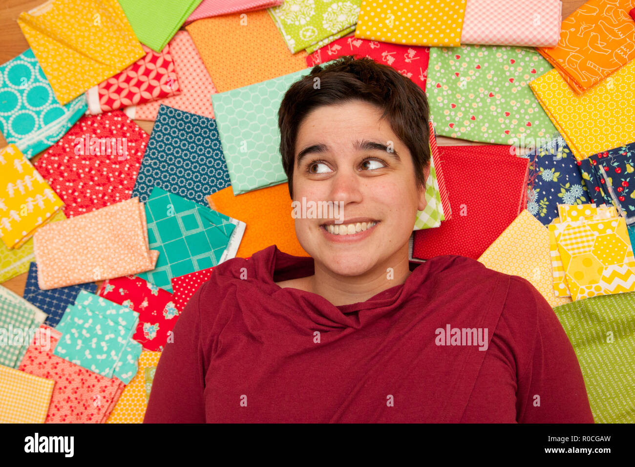 Colorful fat quarters or swatches of red, blue and yellow with a ...