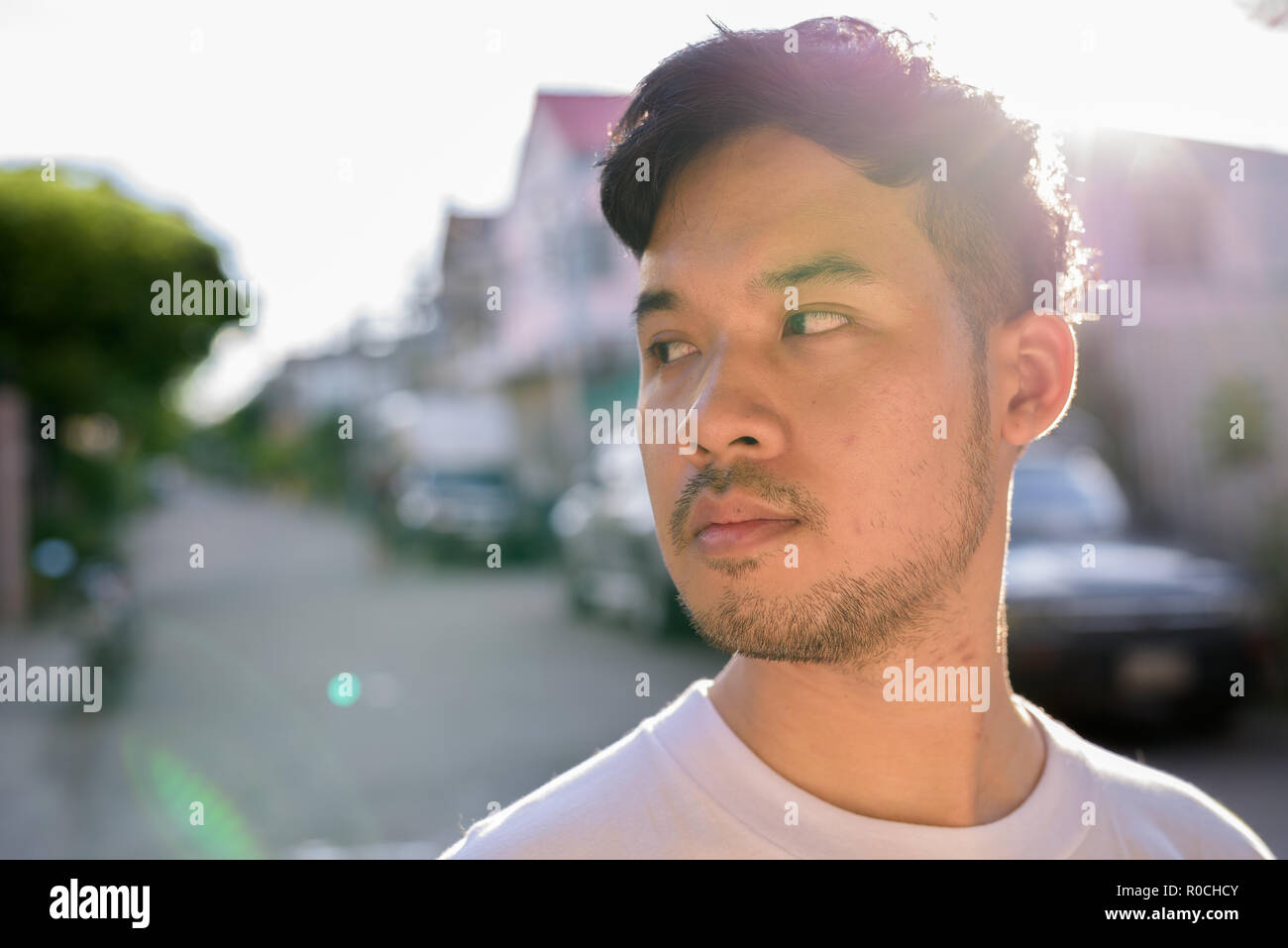 Young asian man face close hi-res stock photography and images - Alamy