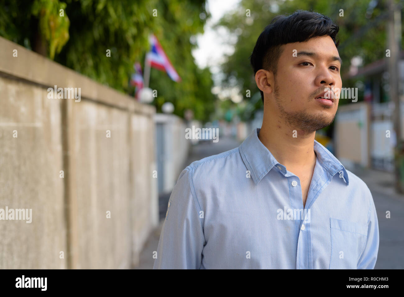 Asian guy in blue shirt hi-res stock photography and images - Alamy