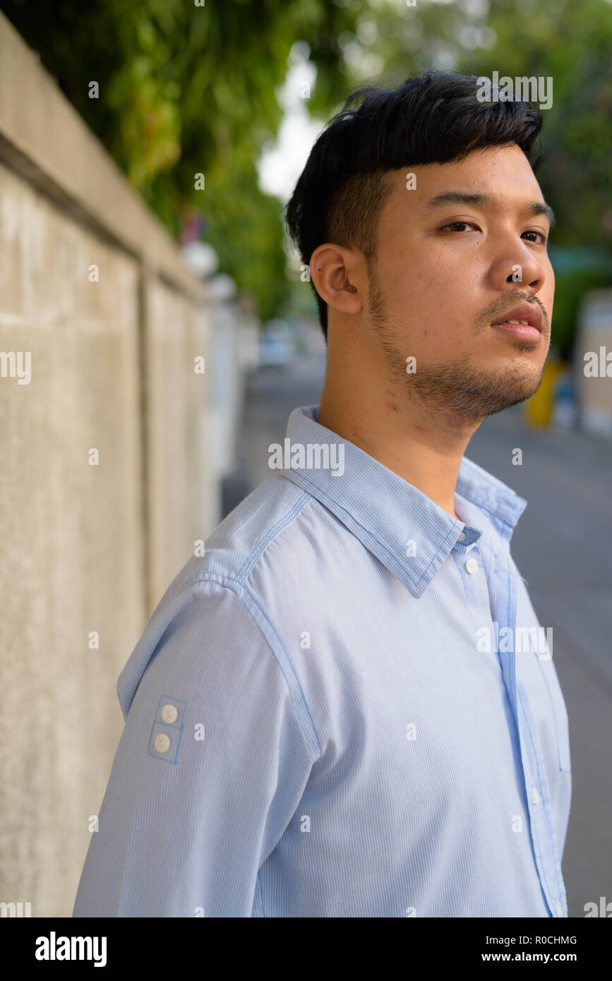 Asian guy in blue shirt hi-res stock photography and images - Alamy