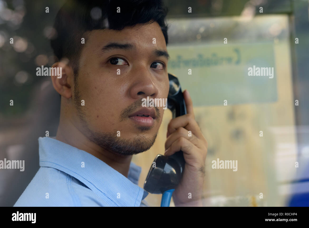 Man using payphone hi-res stock photography and images - Alamy