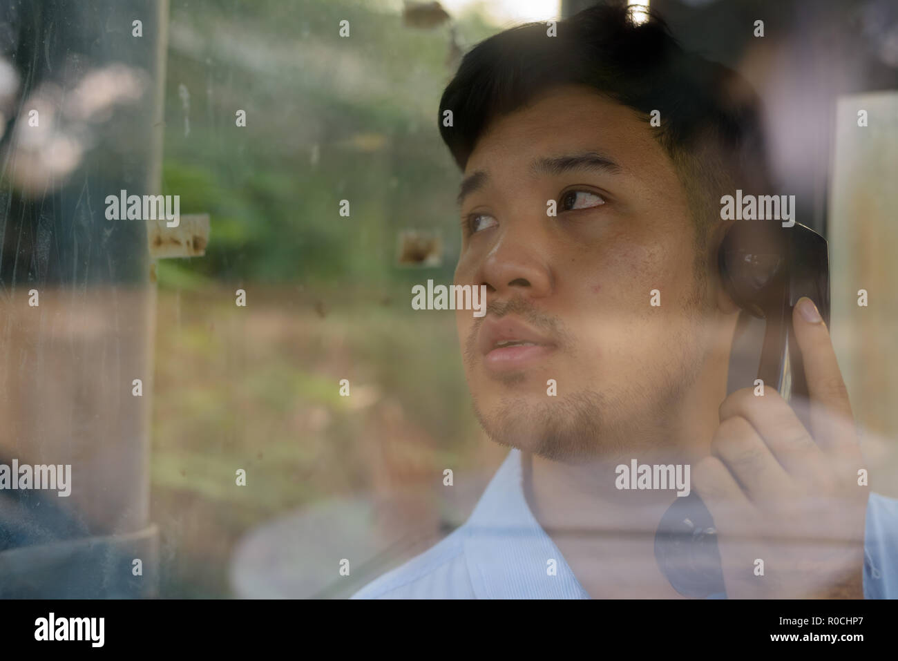 Man using payphone hi-res stock photography and images - Alamy