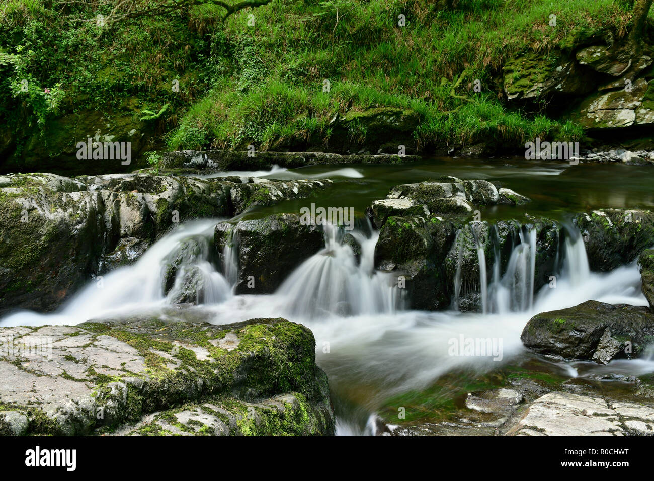 Long exposure of a waterfall at Watersmeet in Devon Stock Photo - Alamy
