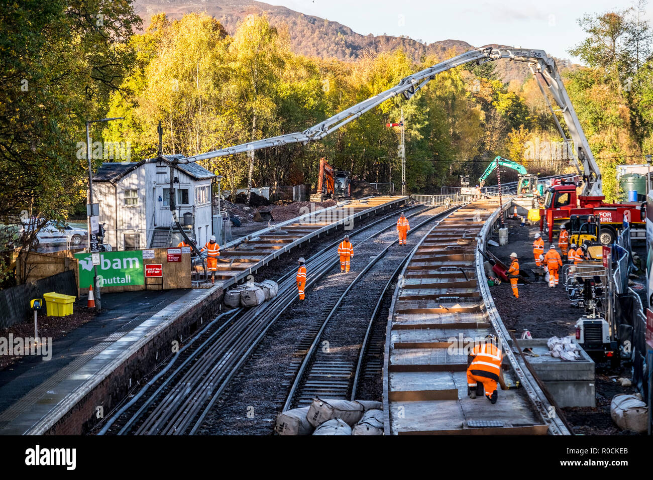 Rail Construction workers building a new platform in station Stock ...