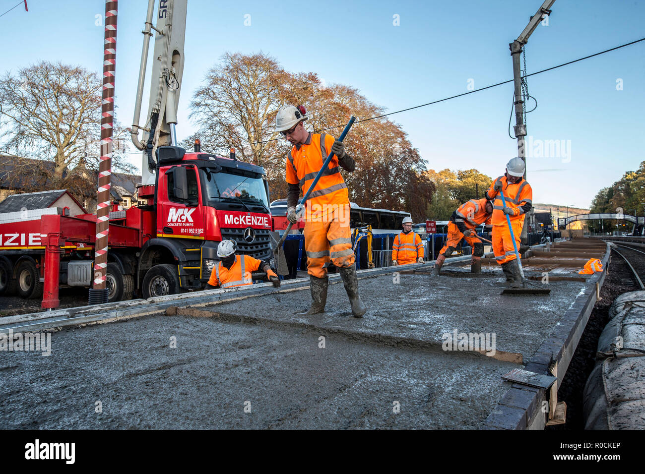 Rail Construction workers building a new platform in station Stock ...