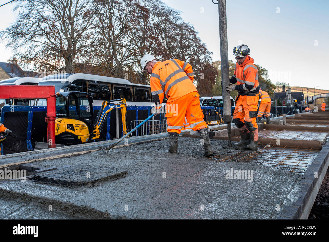 Rail Construction workers building a new platform in station Stock ...