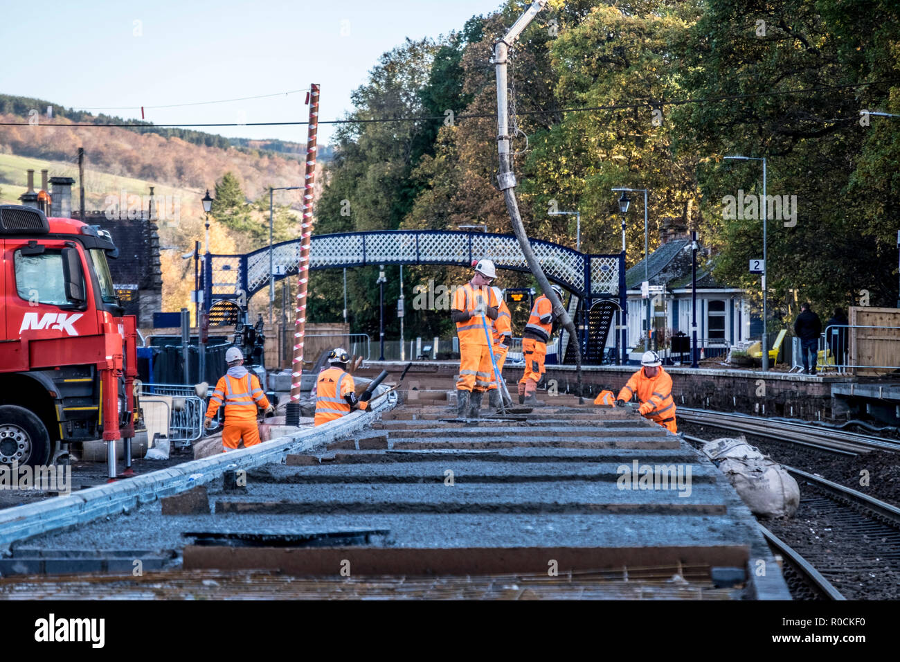 Rail Construction workers building a new platform in station Stock ...