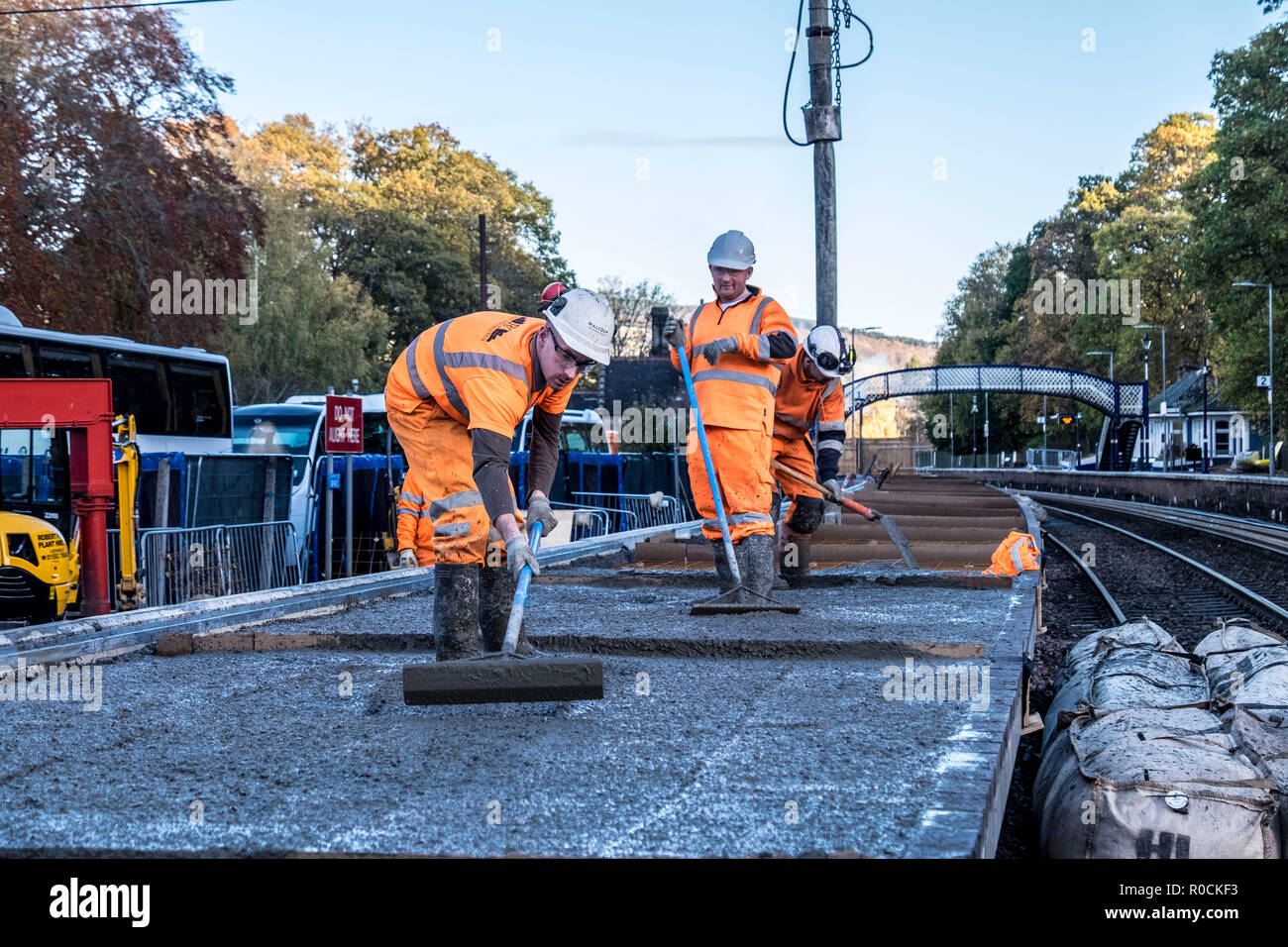 Rail Construction workers building a new platform in station Stock ...