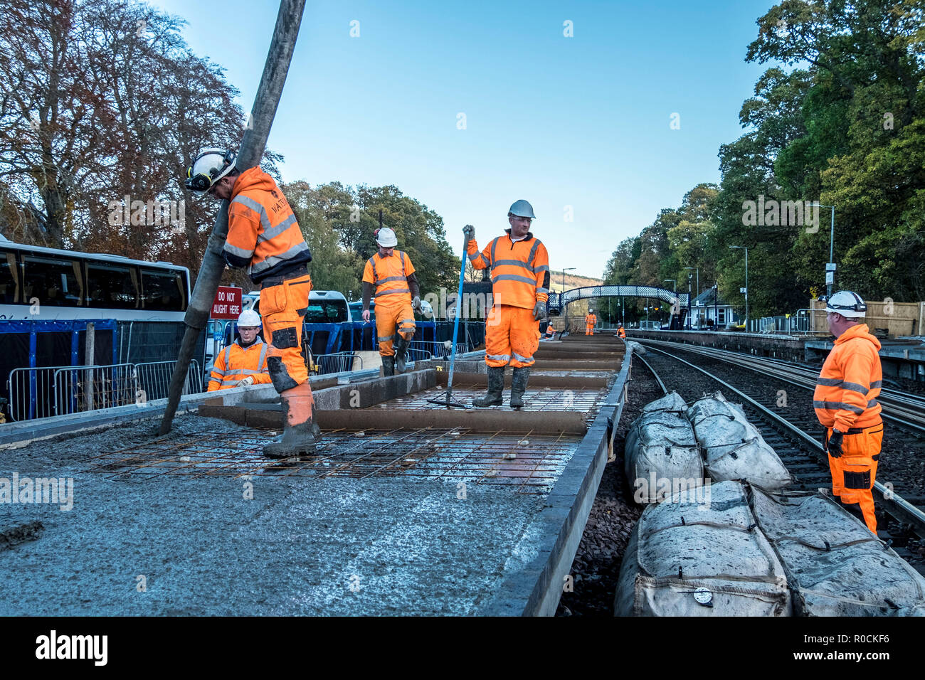 Rail Construction workers building a new platform in station Stock ...