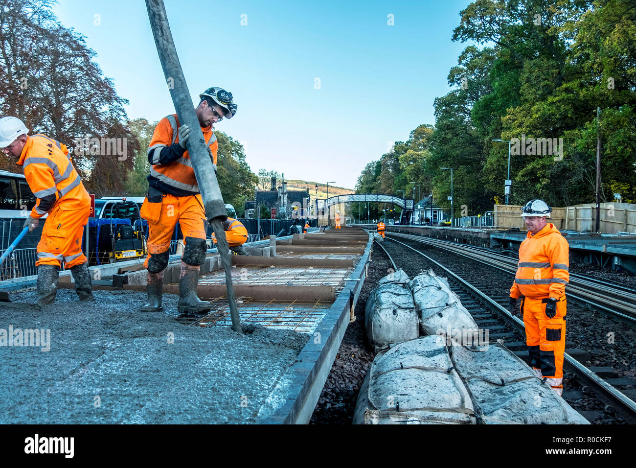 Rail Construction workers building a new platform in station Stock ...