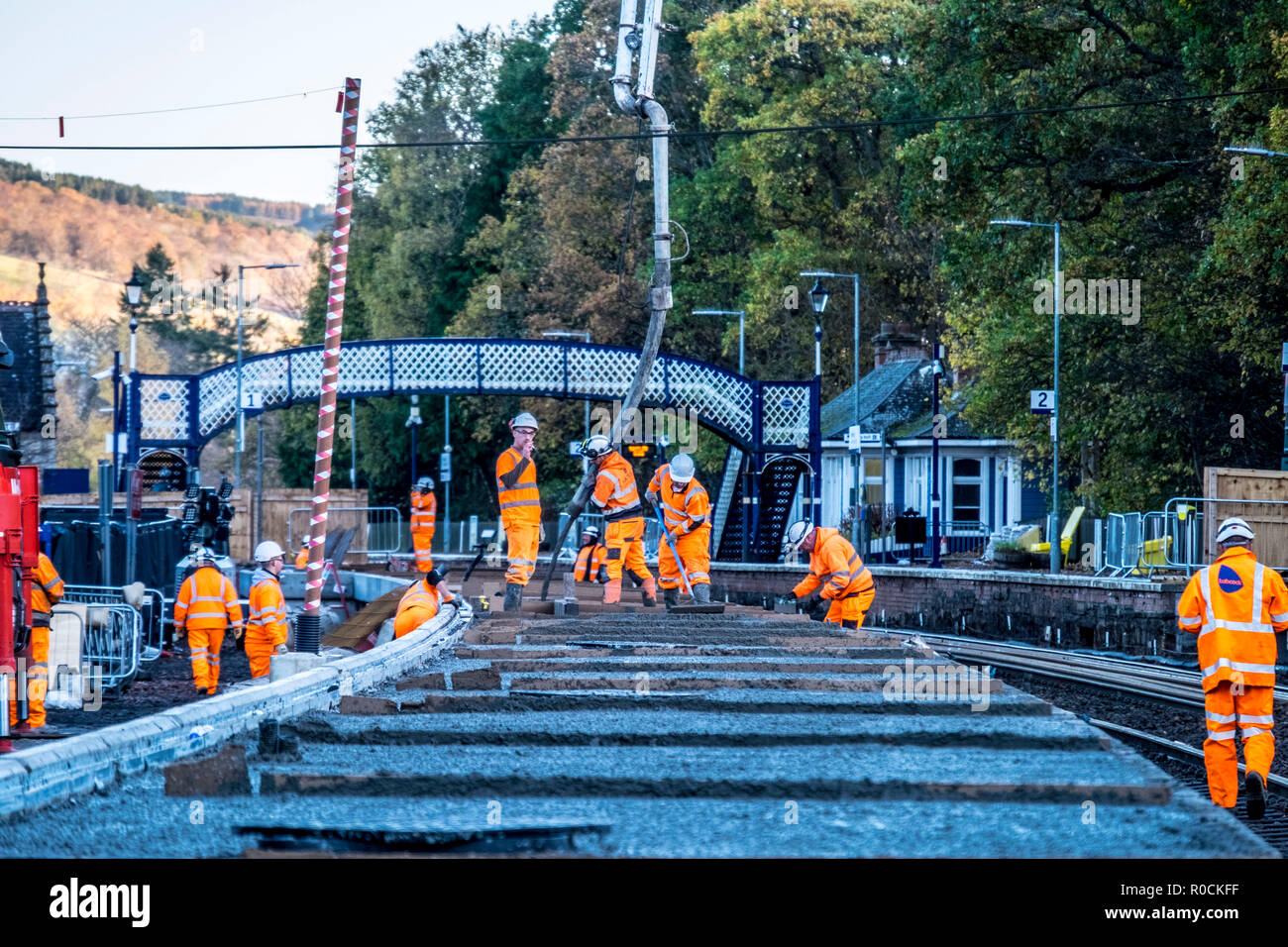 Rail Construction workers building a new platform in station Stock ...
